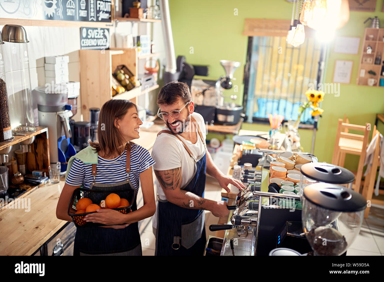 small business owner smiling at workplace with happy employee Stock ...