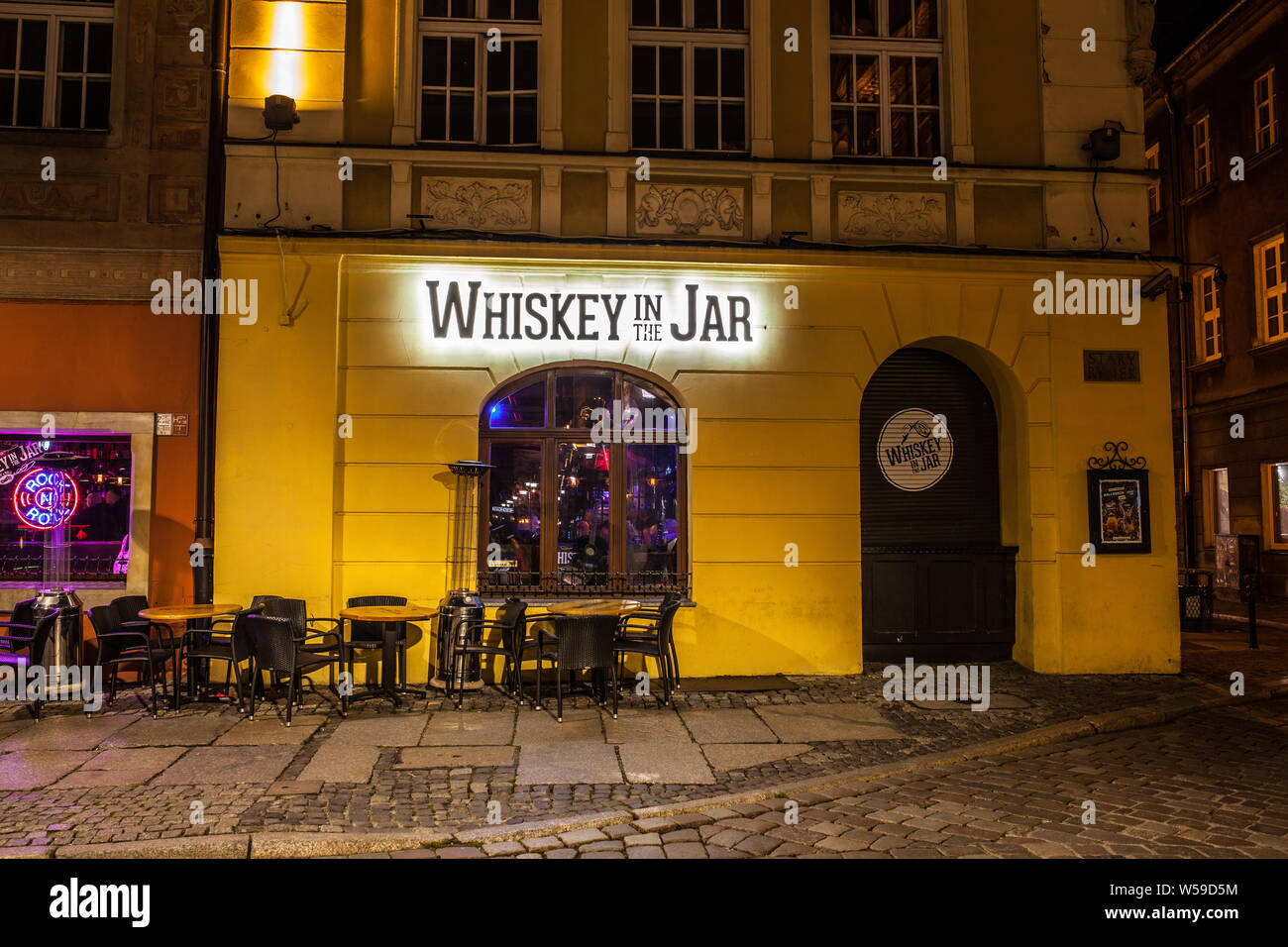 Poznan, Poland, Nov 2017: old Market Square at night, restaurant, bar ...