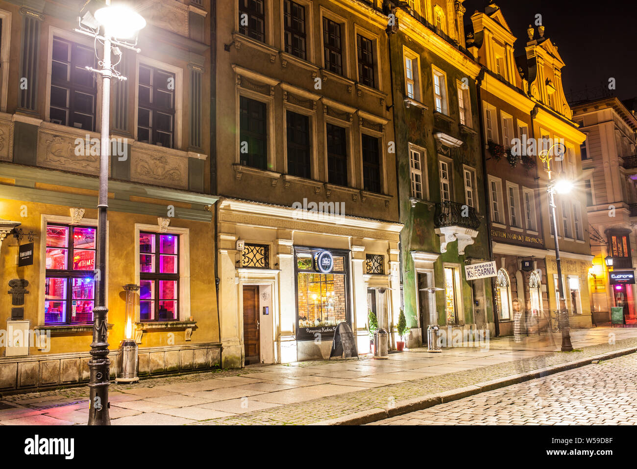 Poznan, Poland, Nov 2017: old Market Square at night, restaurant, bar ...
