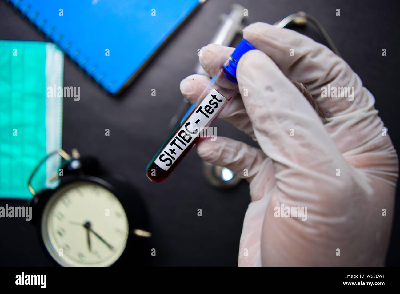 SI+TIBC - Test with blood sample. Top view isolated on black background ...