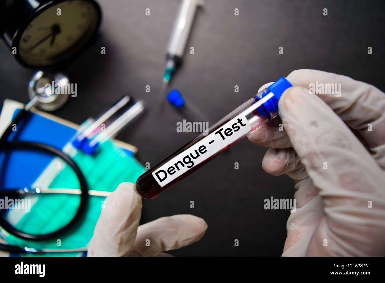 Dengue - Test with blood sample. Top view isolated on black background ...
