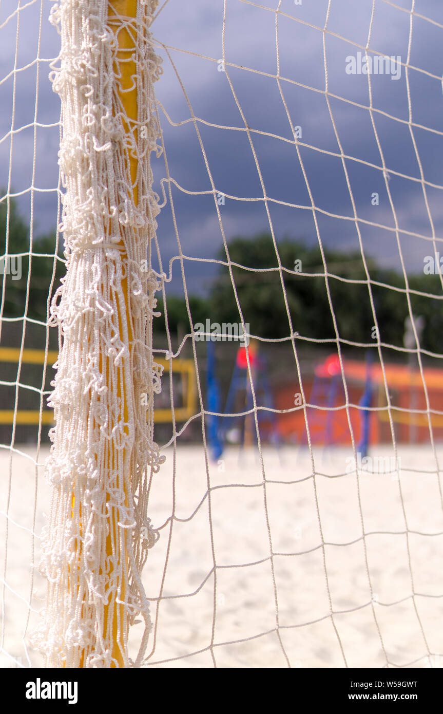close-up of white net on sandy sport field. background, summer Stock ...