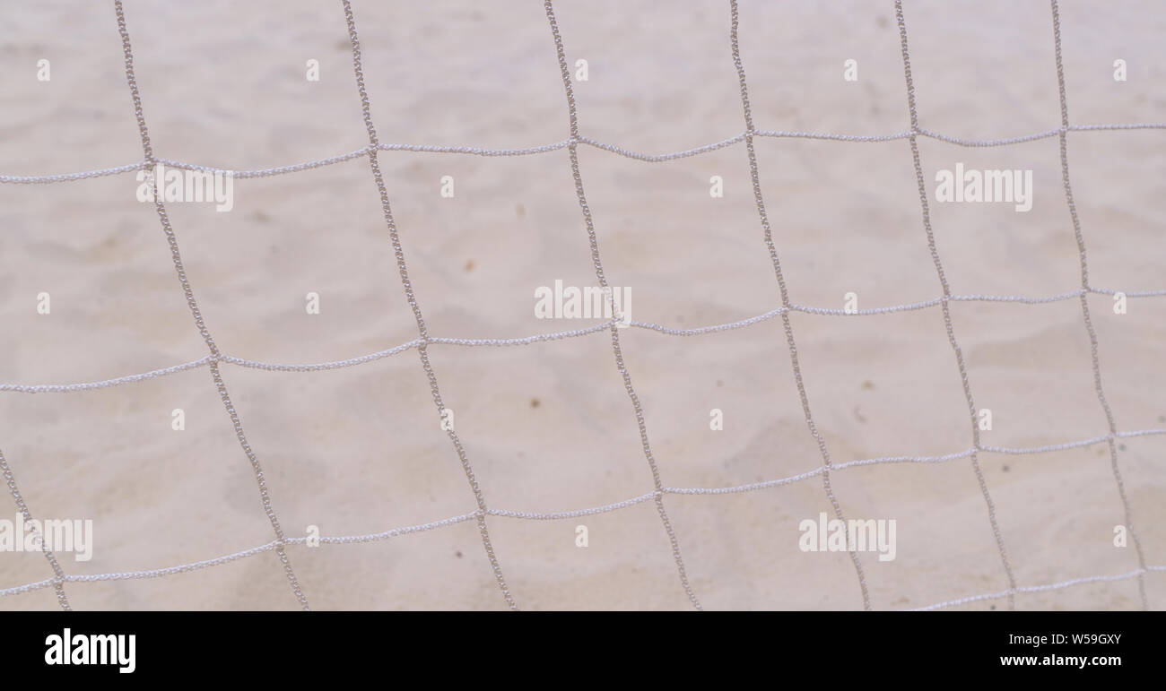 close-up of white net on sandy sport field. background, summer Stock ...