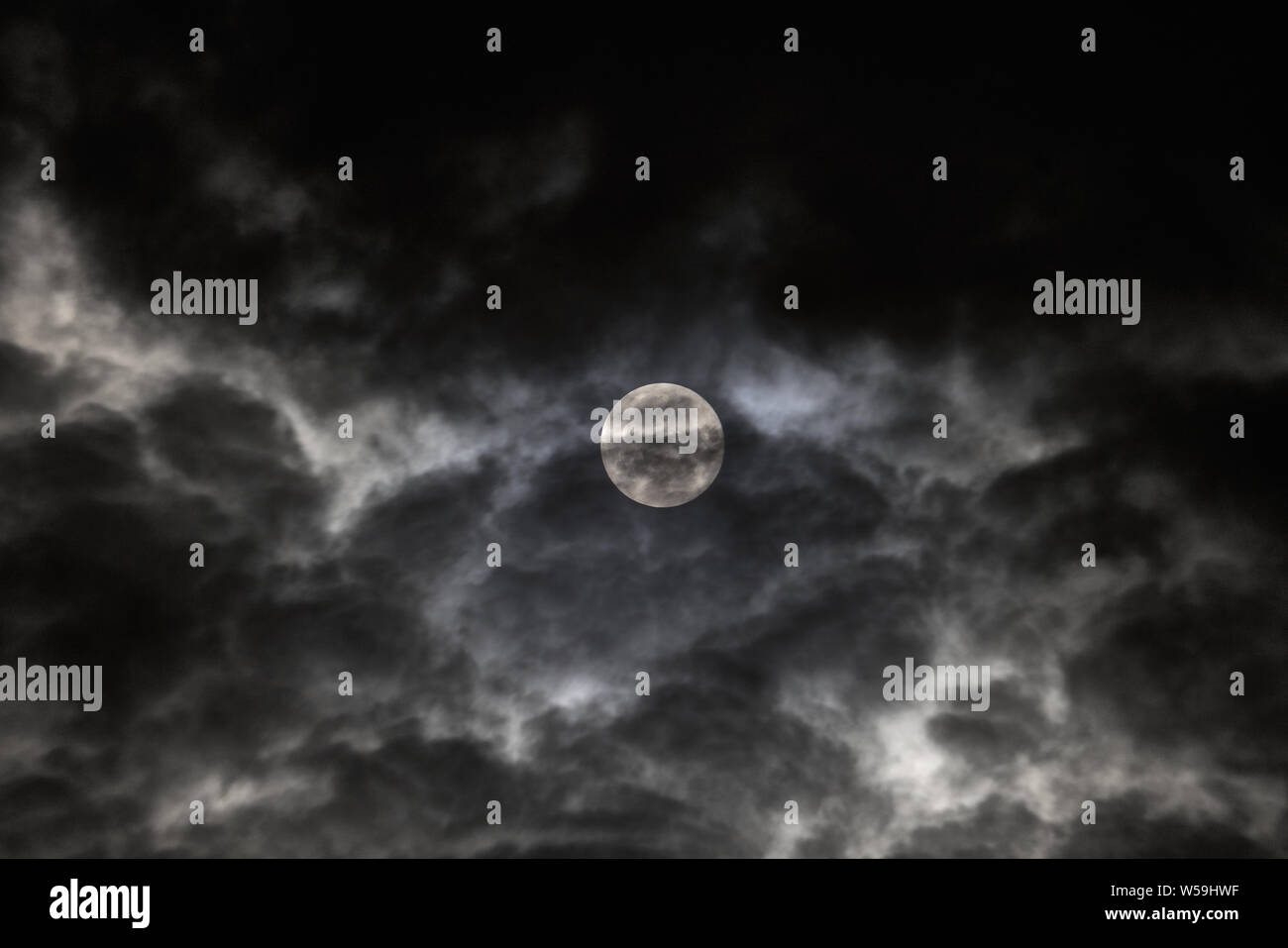 Full moon through clouds hi-res stock photography and images - Alamy
