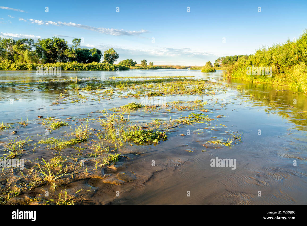 shallow and wide Dismal RIver meandering trough Nebraska Sandhills at ...