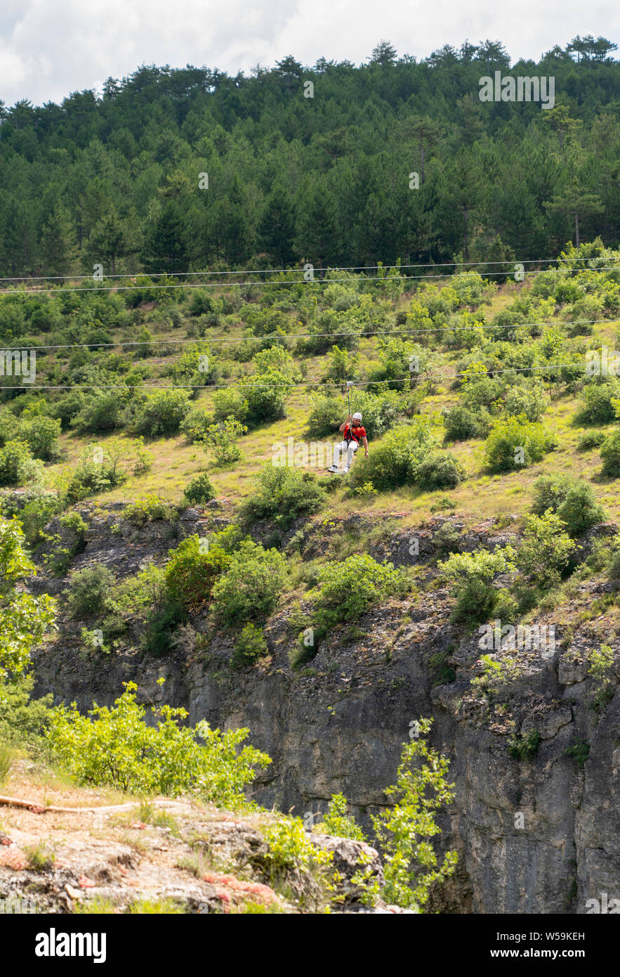 Girl ziplining hi-res stock photography and images - Alamy