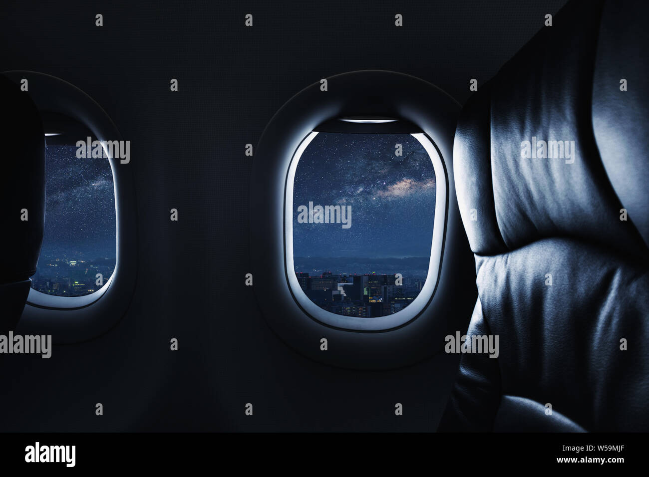 Looking through airplane window at night with sky full of stars and ...