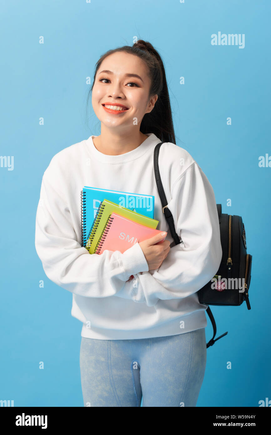 Nice female student smiling and looking at camera Stock Photo - Alamy
