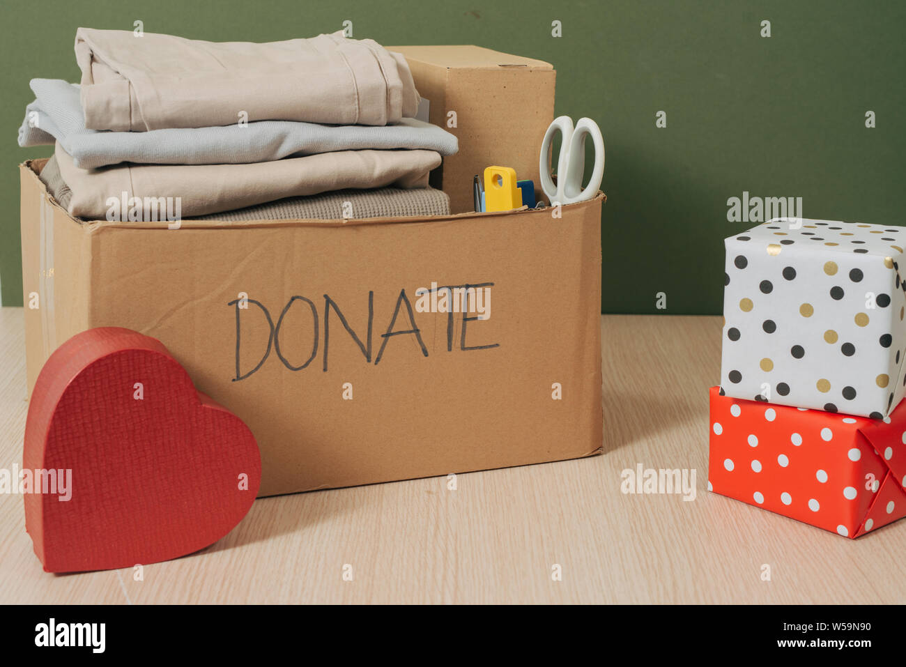 clothes in box for concept donation and reuse recycle Stock Photo - Alamy