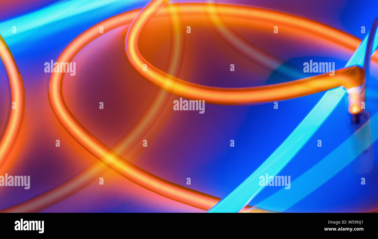 Golden orange neon tube lamp Stock Photo - Alamy