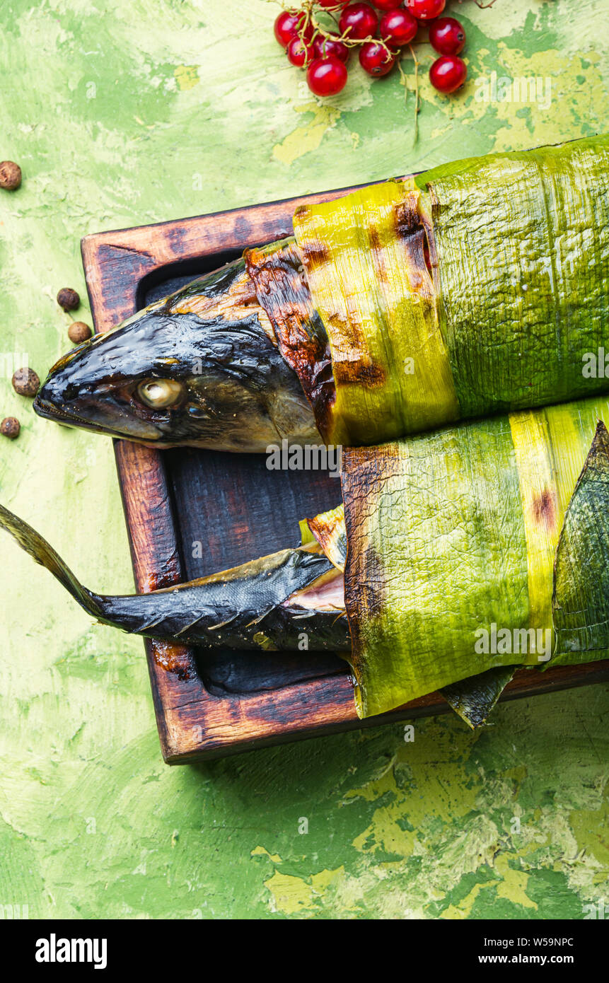 Baked mackerel stuffed with berries.Fish with currant filling.Seafood ...