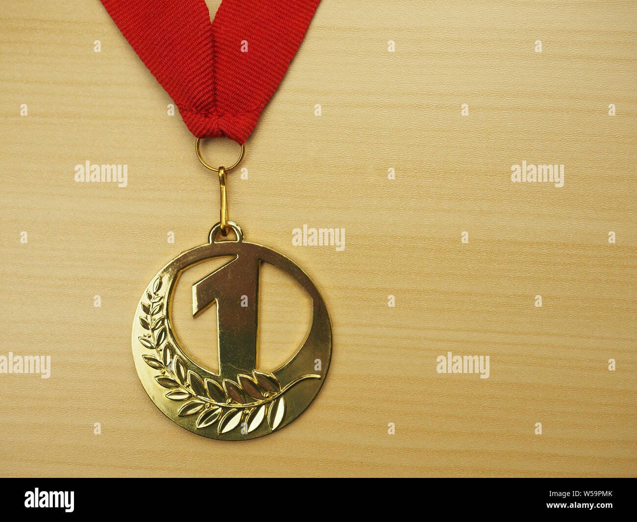 Gold first place winners medal. Success achievement concept Stock Photo ...