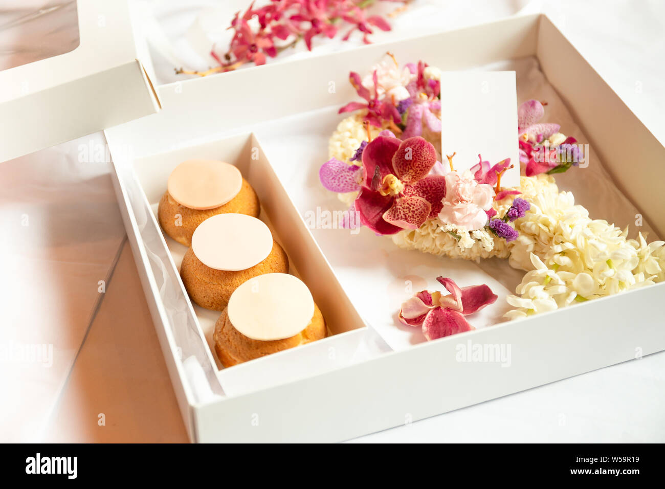 French profiteroles in gift box with flower for ocation Stock Photo - Alamy
