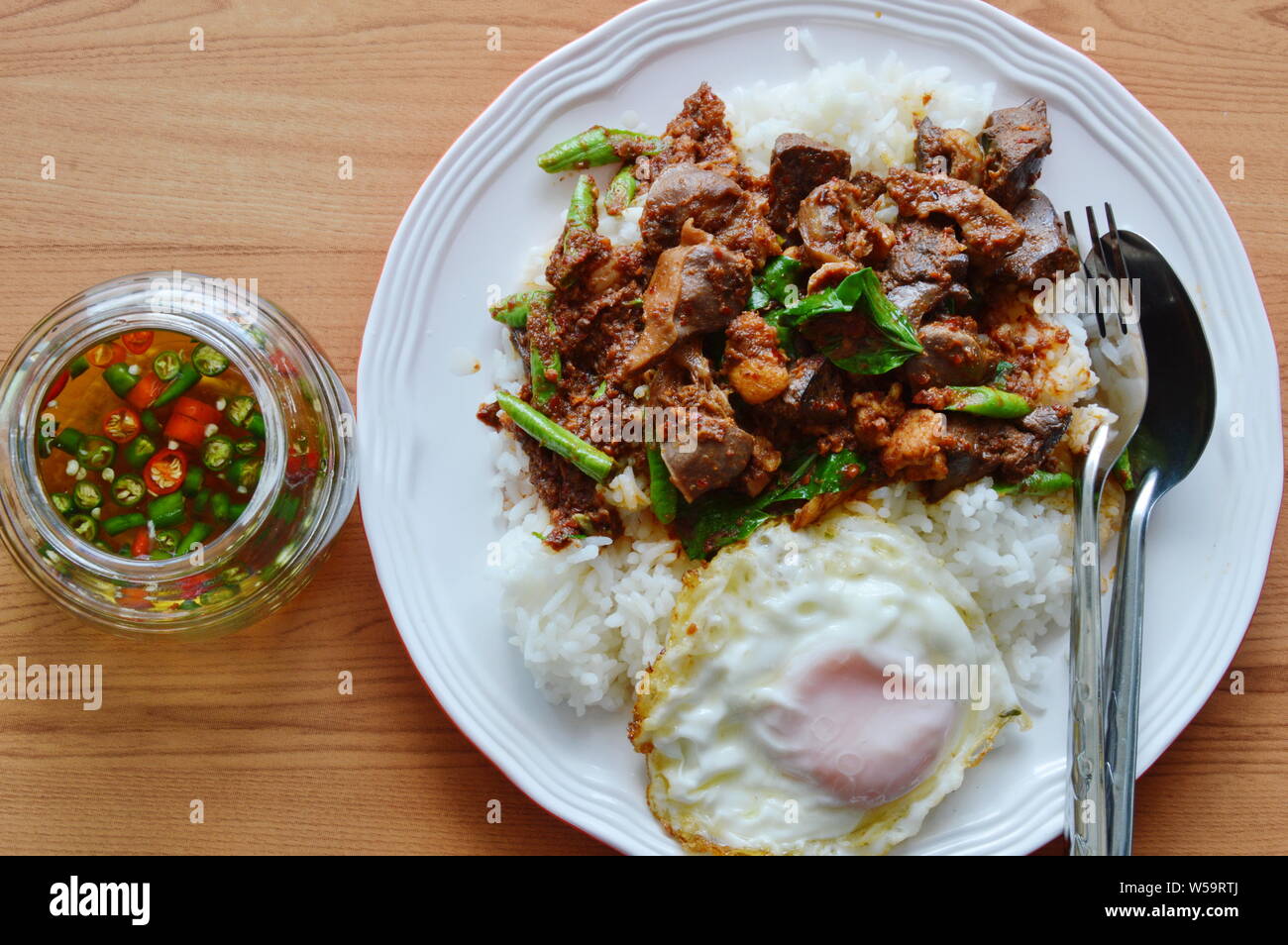 spicy stir fried chicken entrails curry and egg with fish chili sauce ...