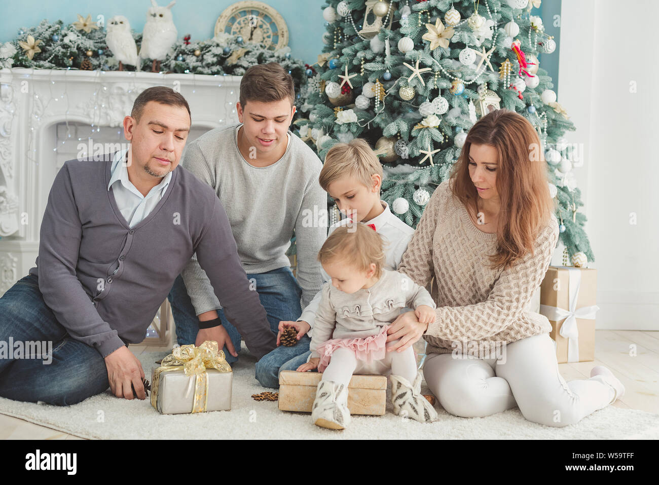 joy and happiness concept. portrait of large family gathering. sitting ...