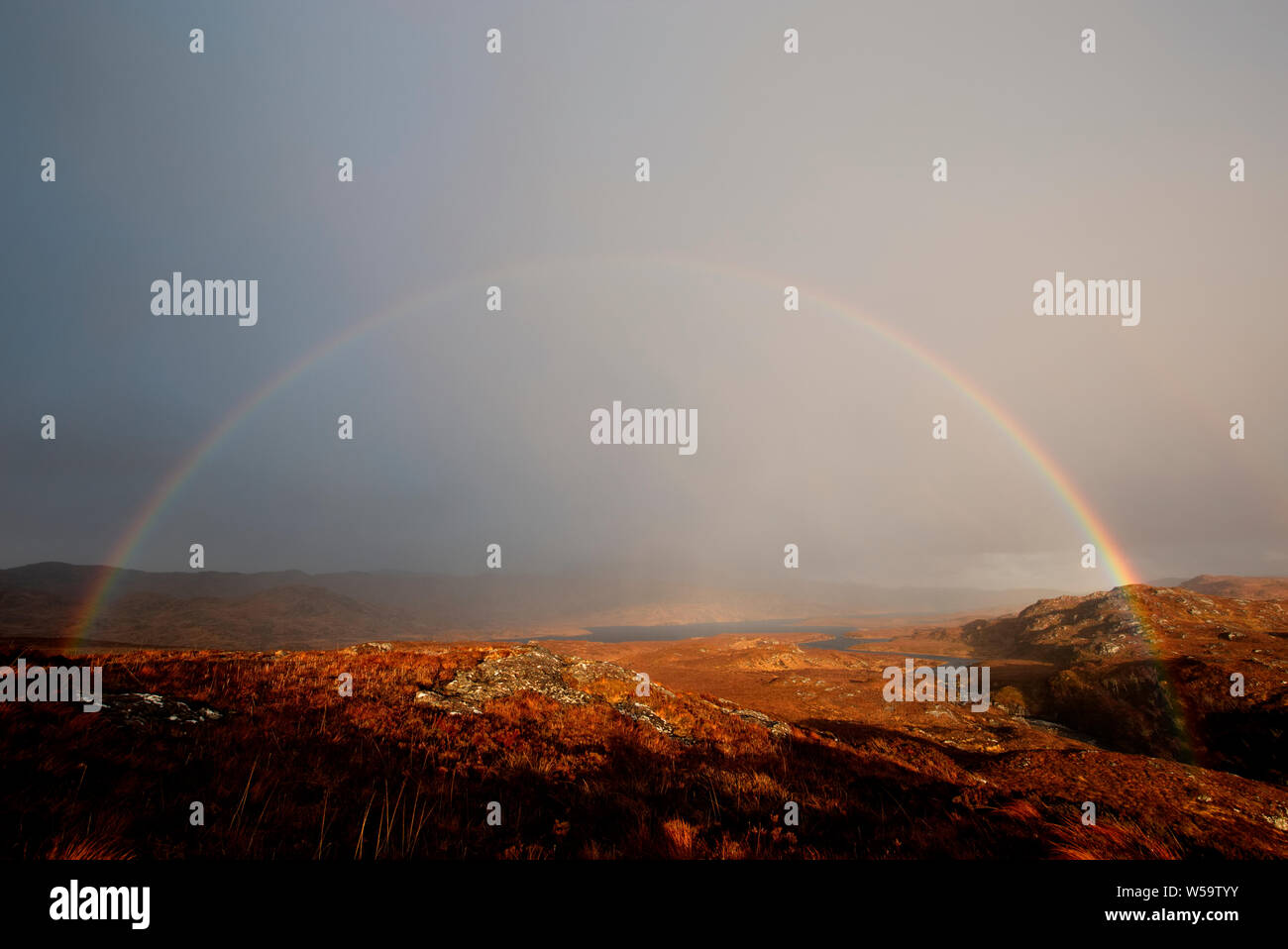 Rainbow over Sutherland wilderness, Highland Scotland Stock Photo - Alamy