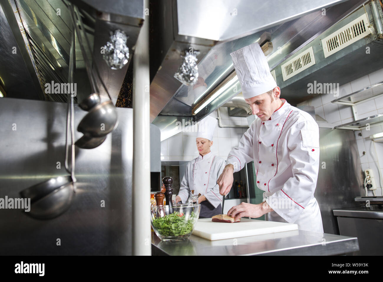 Man chopping meat at meat market hi-res stock photography and images ...