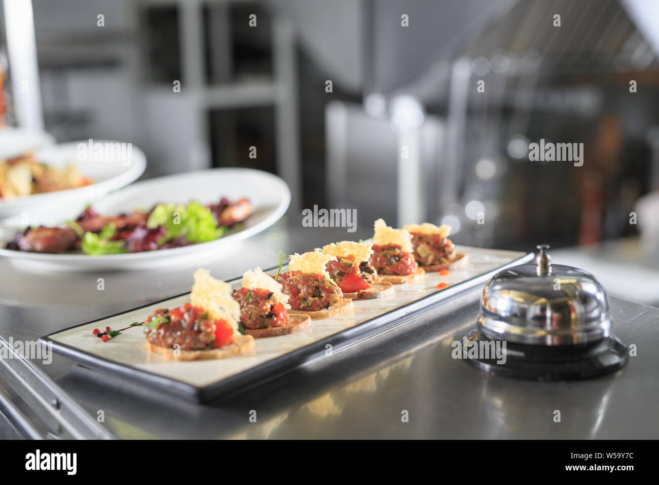 the distribution table in the kitchen of the restaurant Stock Photo - Alamy