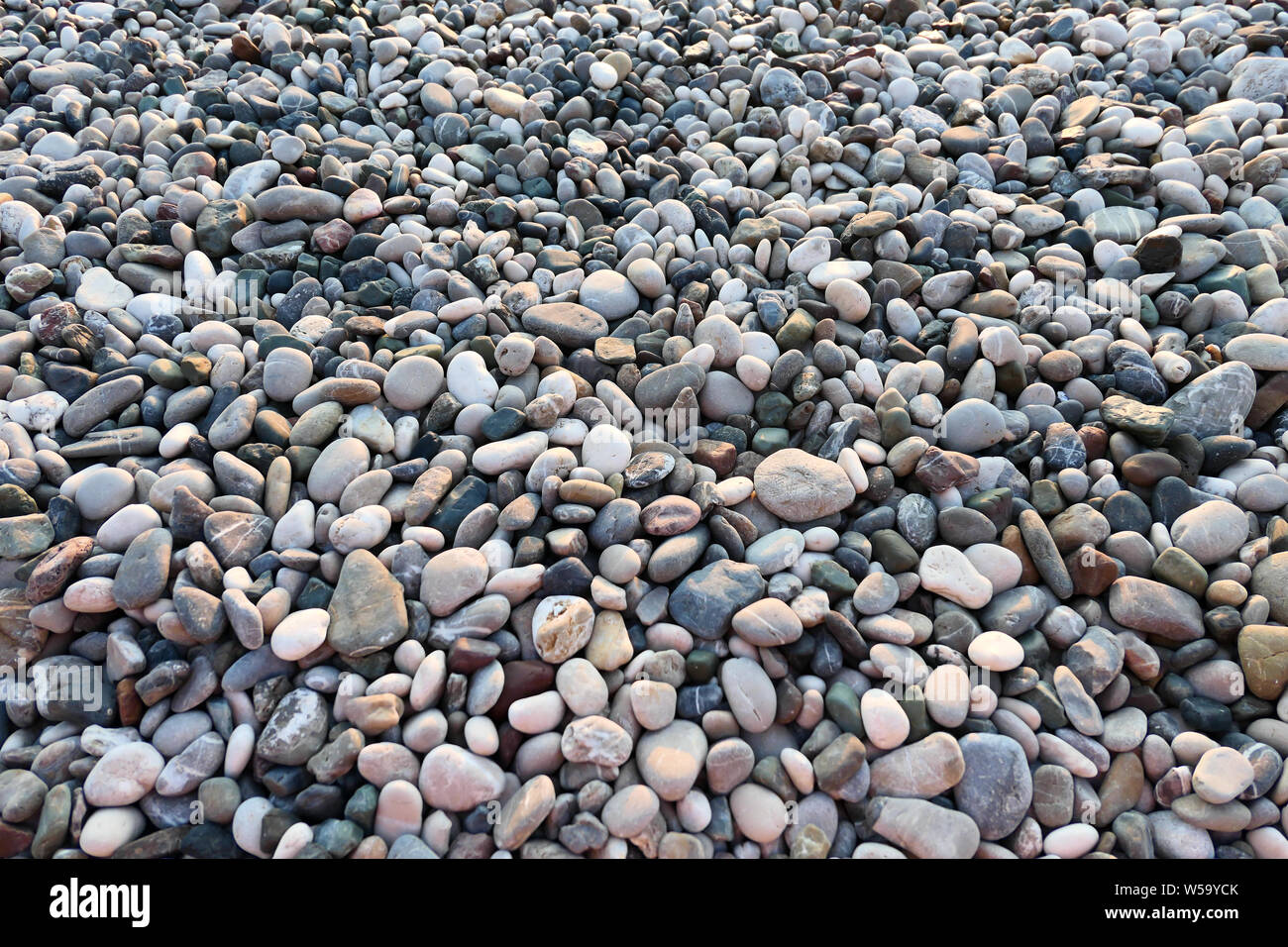Grey pebble as a background Stock Photo - Alamy