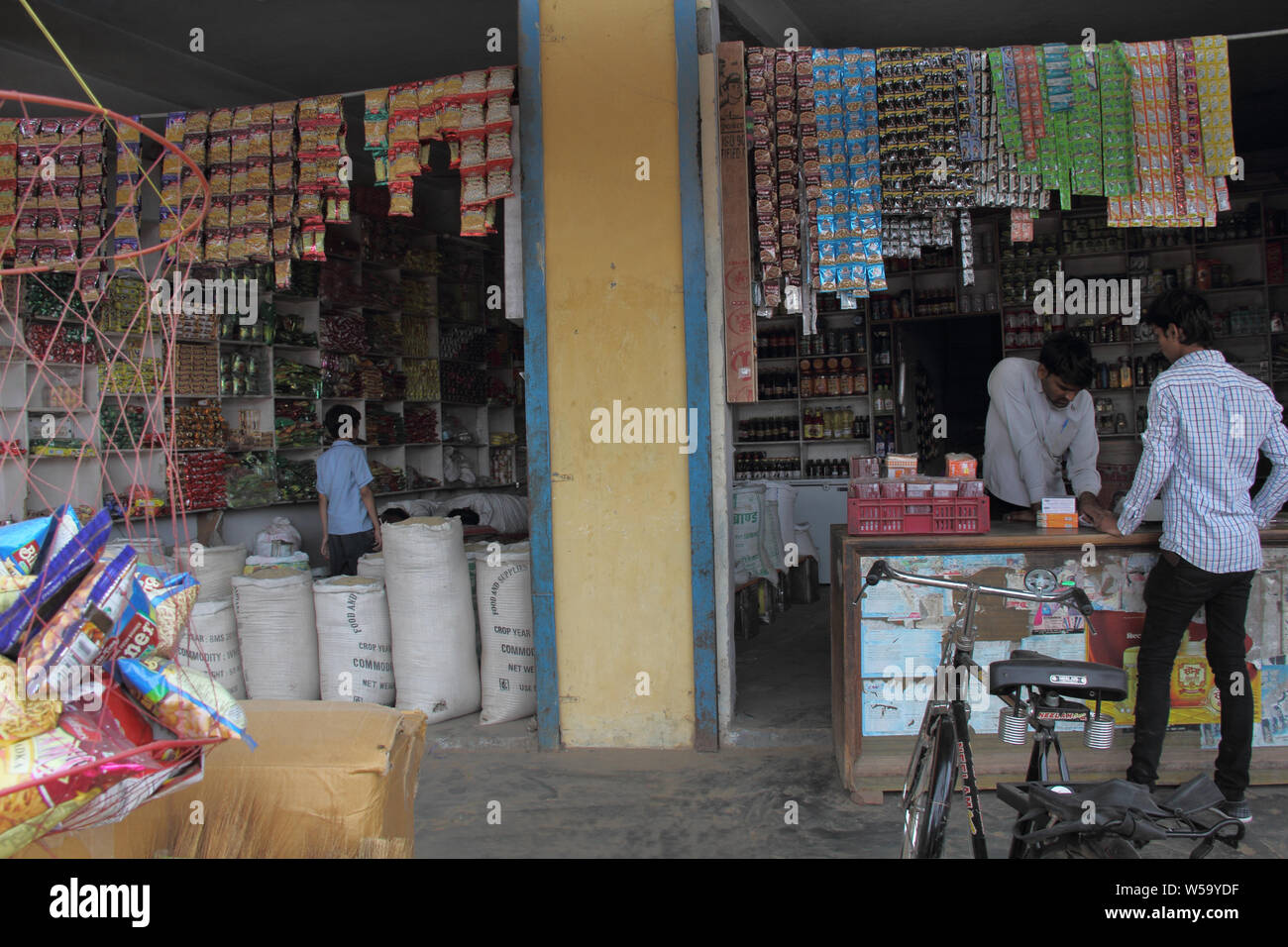 Customer standing at a grocery shop Stock Photo - Alamy