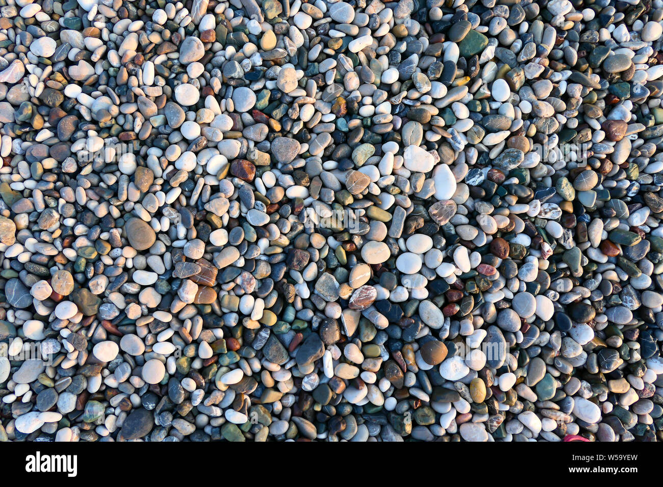 Grey pebble as a background Stock Photo - Alamy