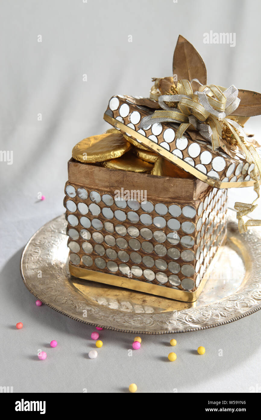 Chocolate coins in a box Stock Photo - Alamy