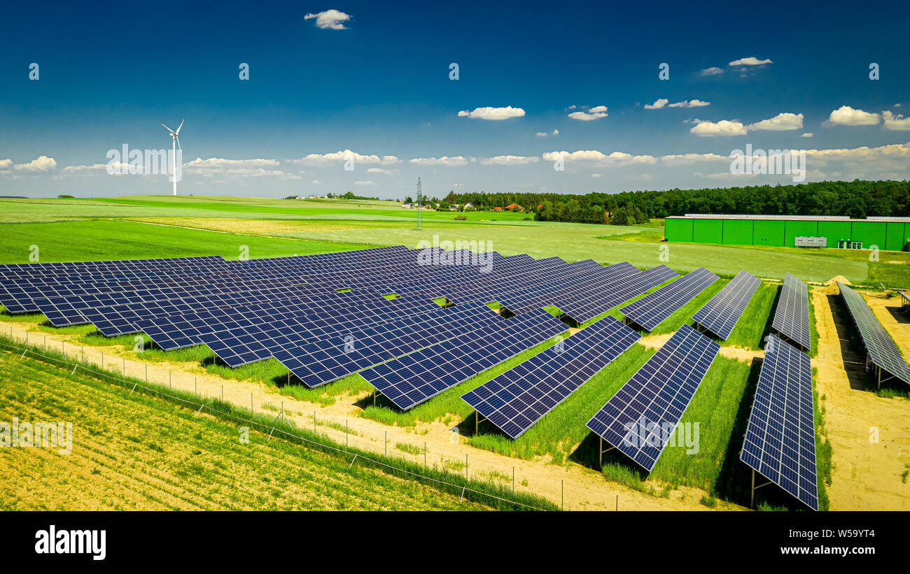 Amazing aerial view of solar panels on green field Stock Photo - Alamy