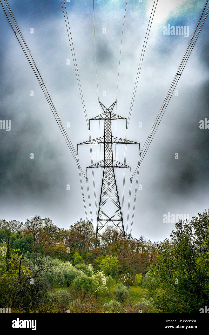 Electric pylon with cables under a dramatic sky Stock Photo - Alamy