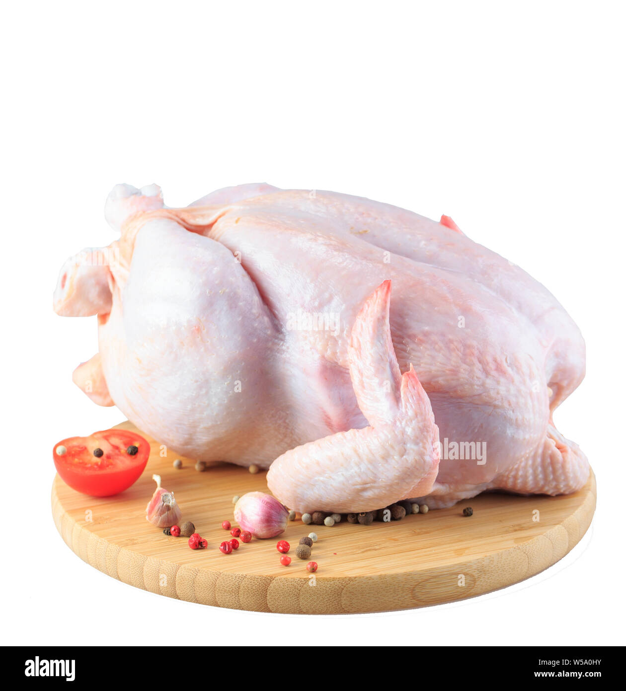 Raw chicken carcass on the cutting board isolated on white background ...