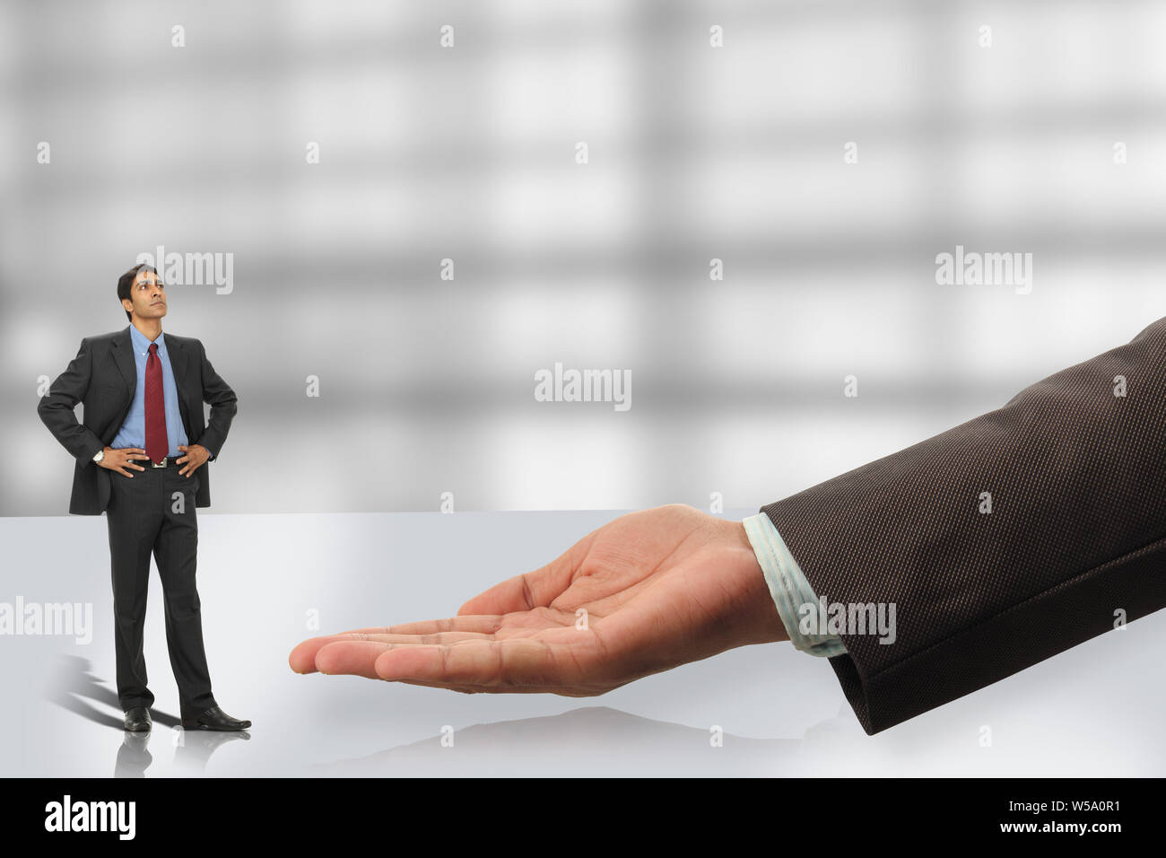 Giant man looking at small man hi-res stock photography and images - Alamy