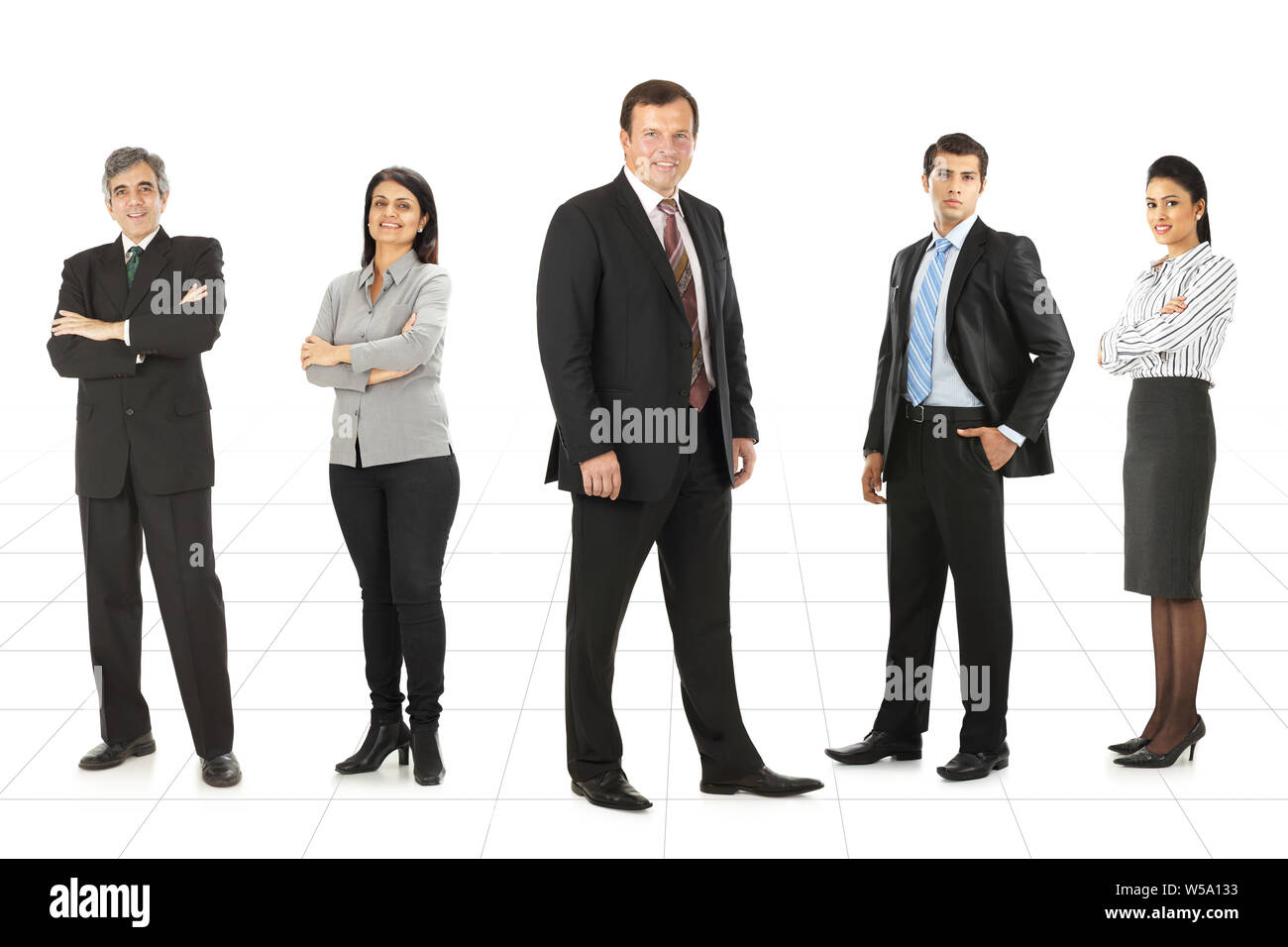 Group of business executives standing together Stock Photo - Alamy