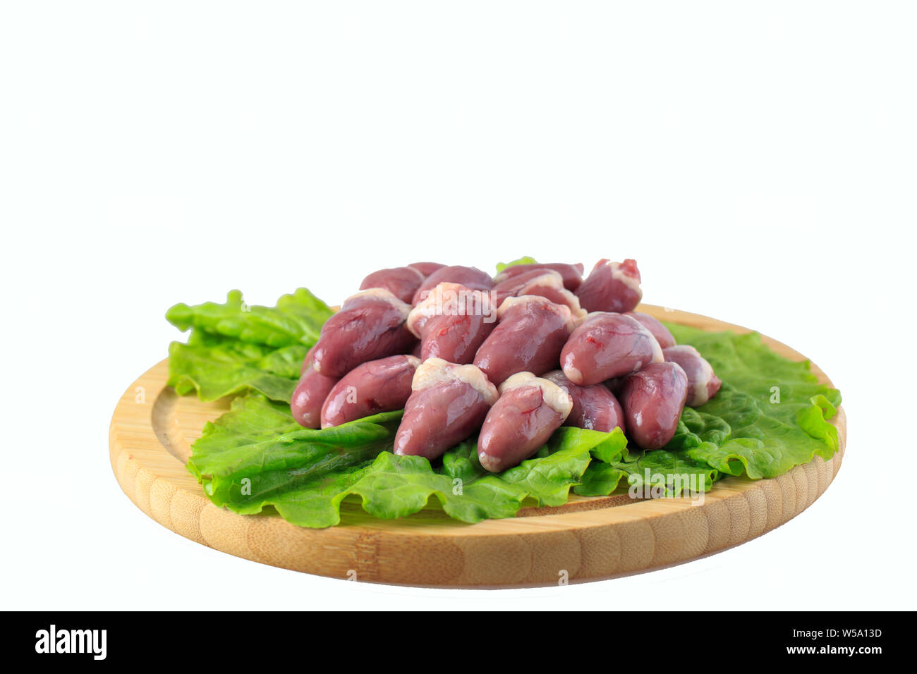 raw chicken hearts on white background on a wooden board Stock Photo ...