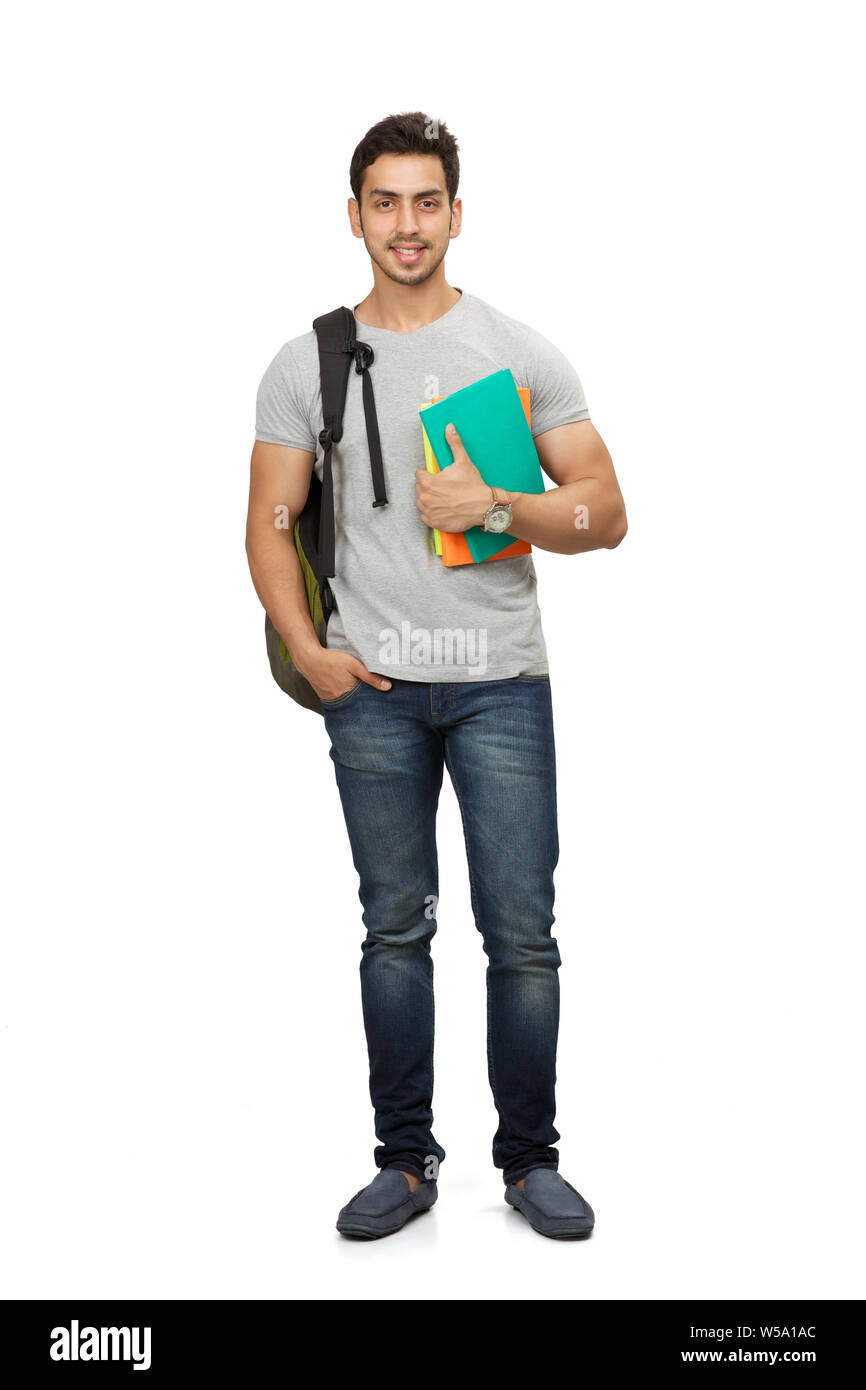 College student holding books Stock Photo - Alamy