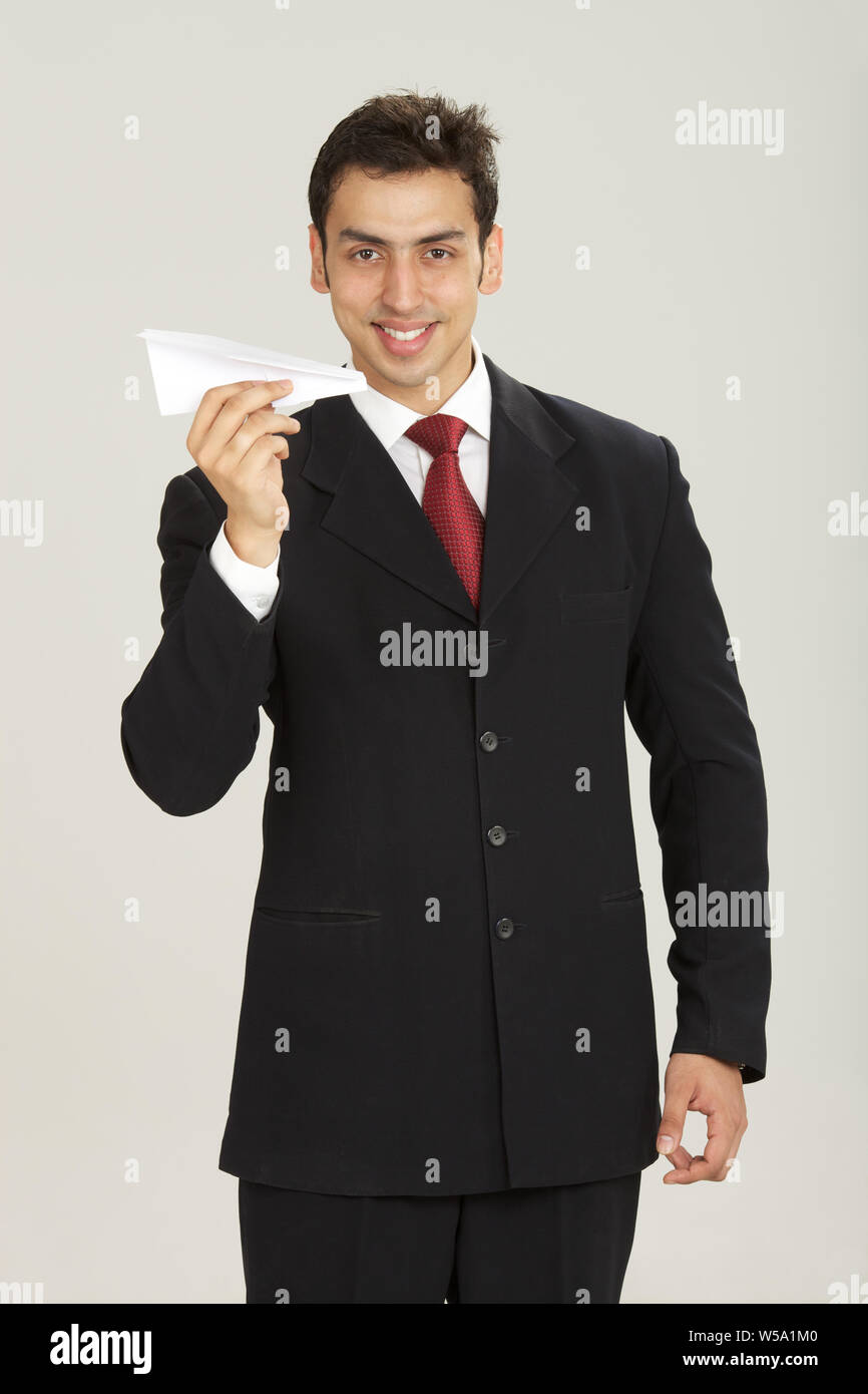 Young smiling businessman paper hi-res stock photography and images - Alamy