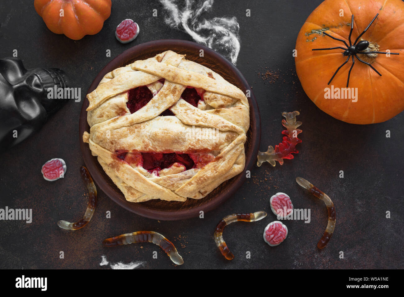 Halloween Mummy Pie, Pumpkins and Halloween Decor on dark background ...