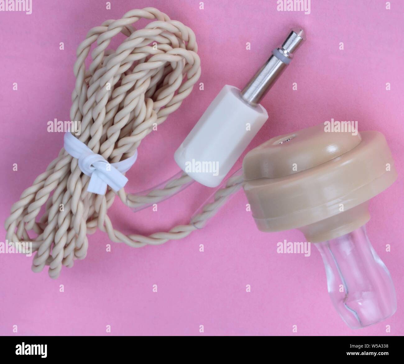 Plastic Headphones on Pink Background Stock Photo - Alamy