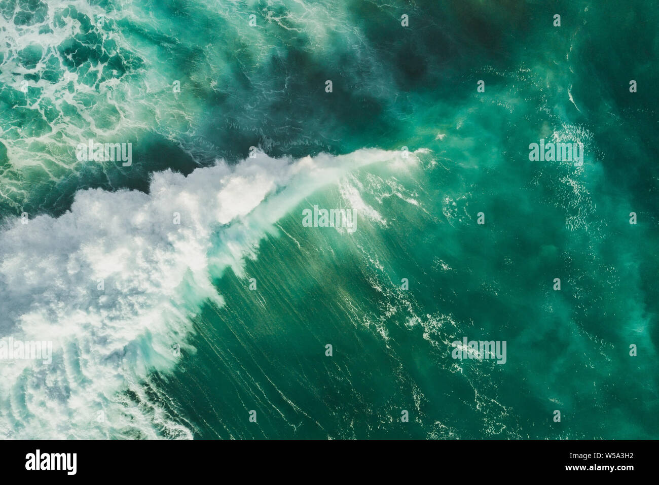 Aerial wave background. Drone shot directly from above, green turquoise ...