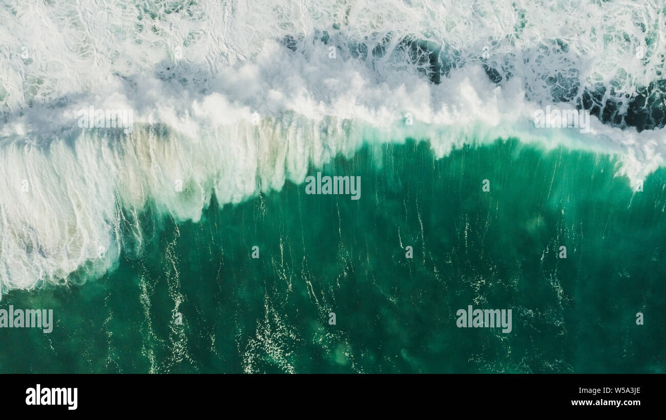 Aerial wave background. Drone shot directly from above, green turquoise ...