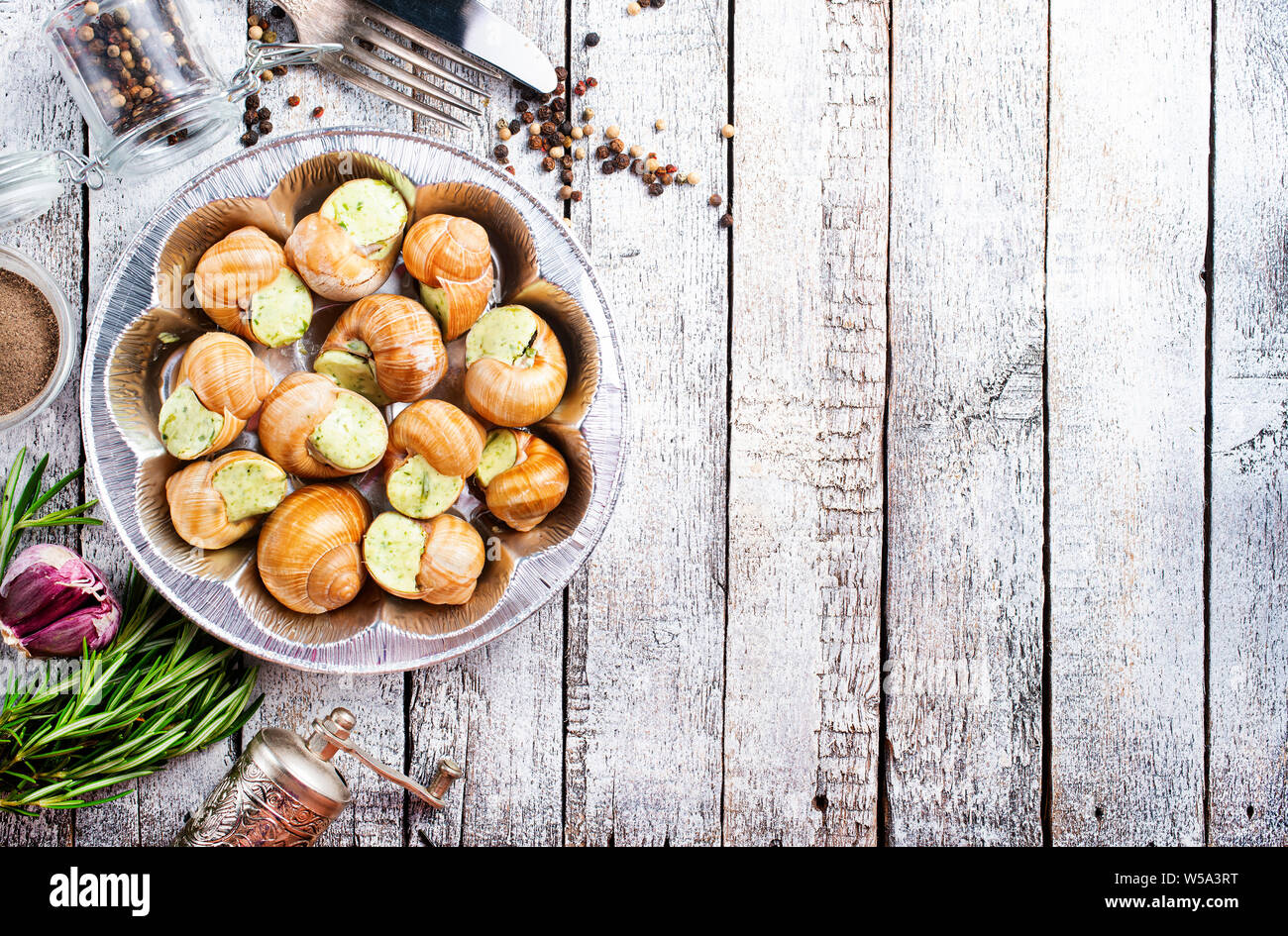 fried snails with garlic spice and butter Stock Photo - Alamy
