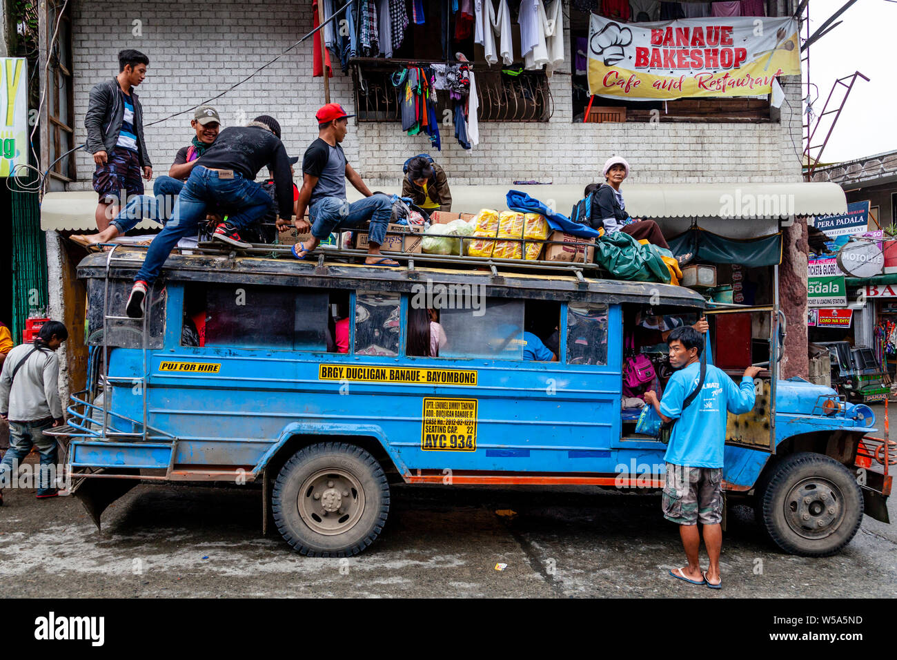 Local People Climb Onto The Roof Of A Jeepney Bus, Banaue, Luzon, The ...
