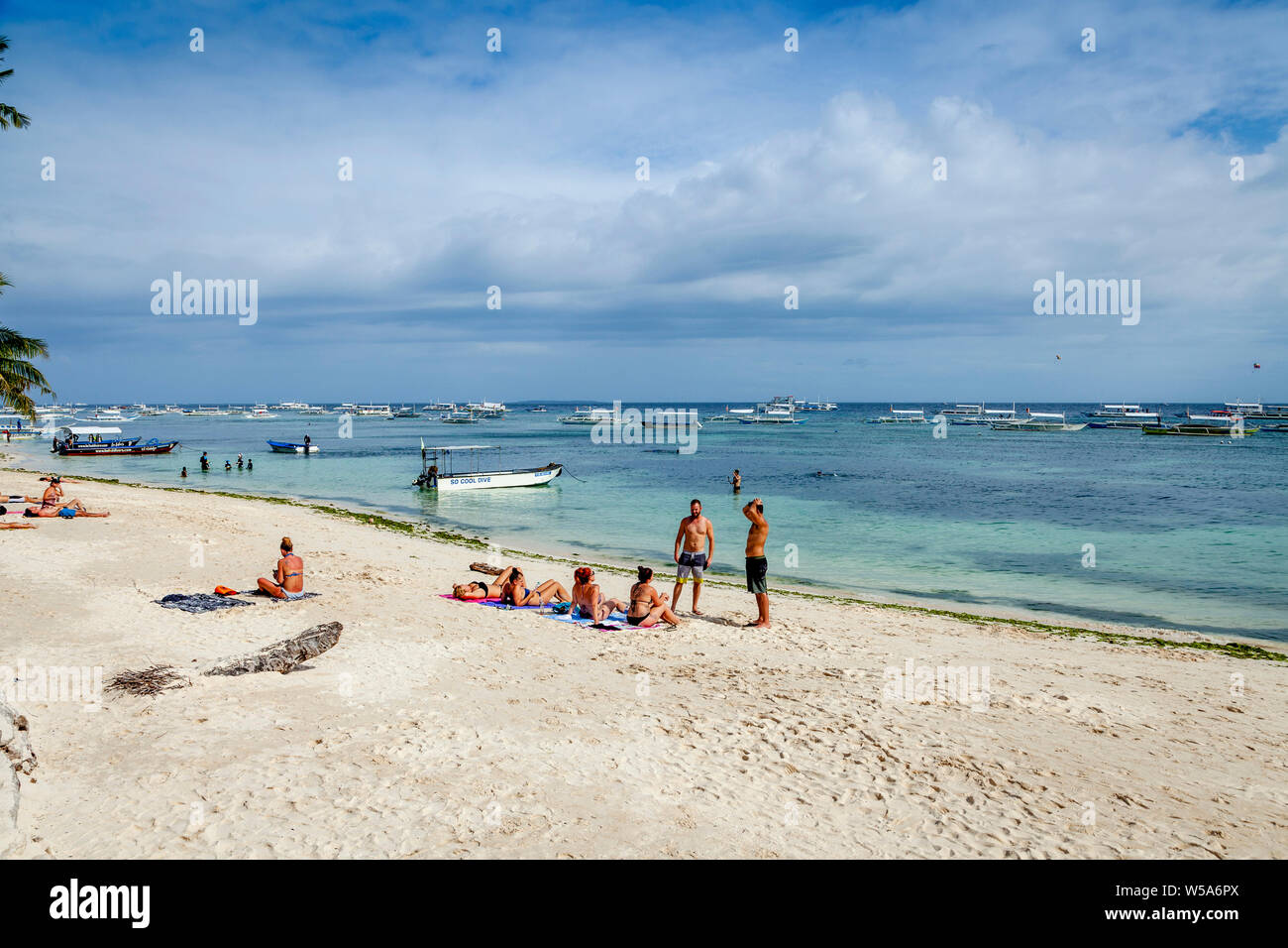 Young People Sunbathing On Alona Beach, Bohol, The Philippines Stock ...