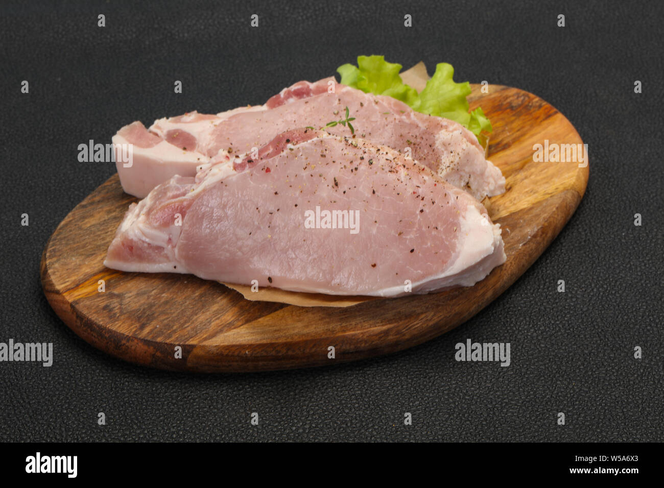 Raw pork meat steak ready for grill Stock Photo - Alamy