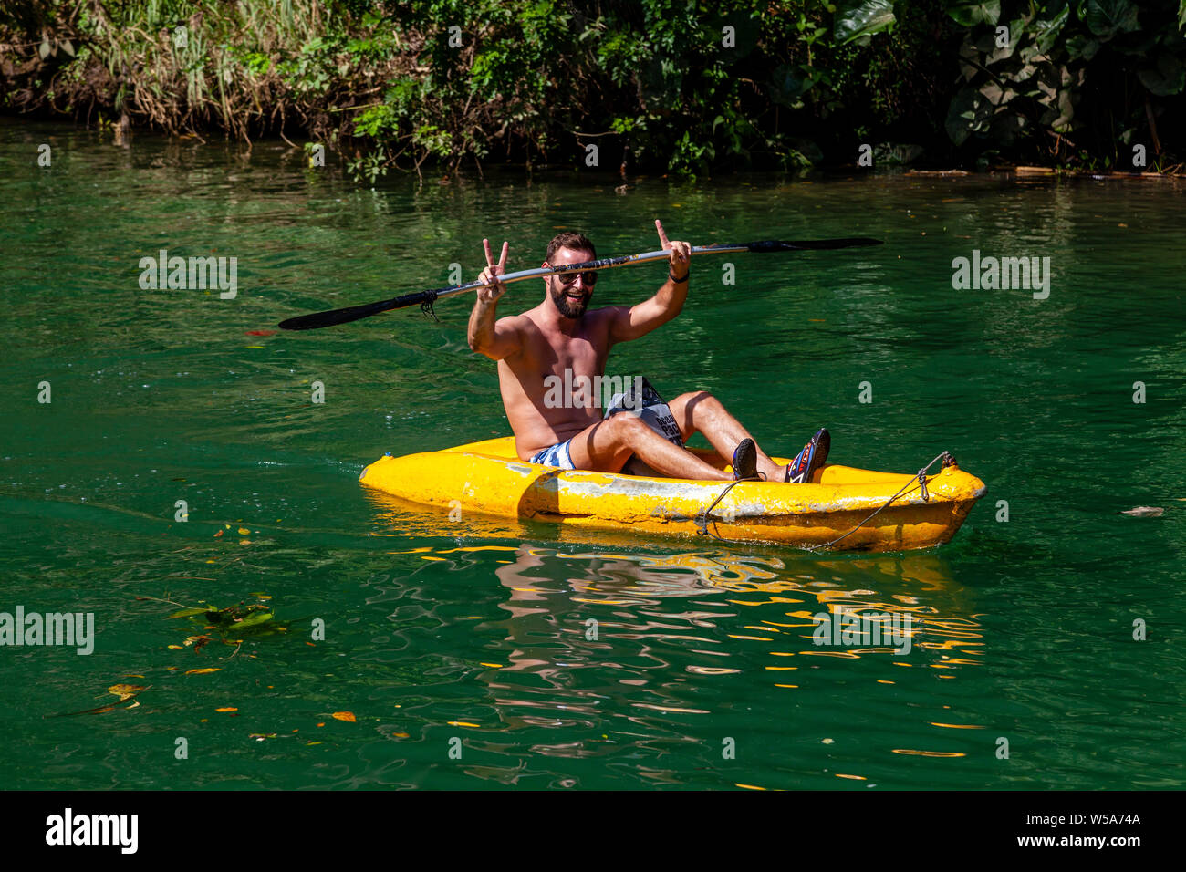 A Tourist Kayaking down The Loboc River, Loboc, Bohol, The Philippines ...