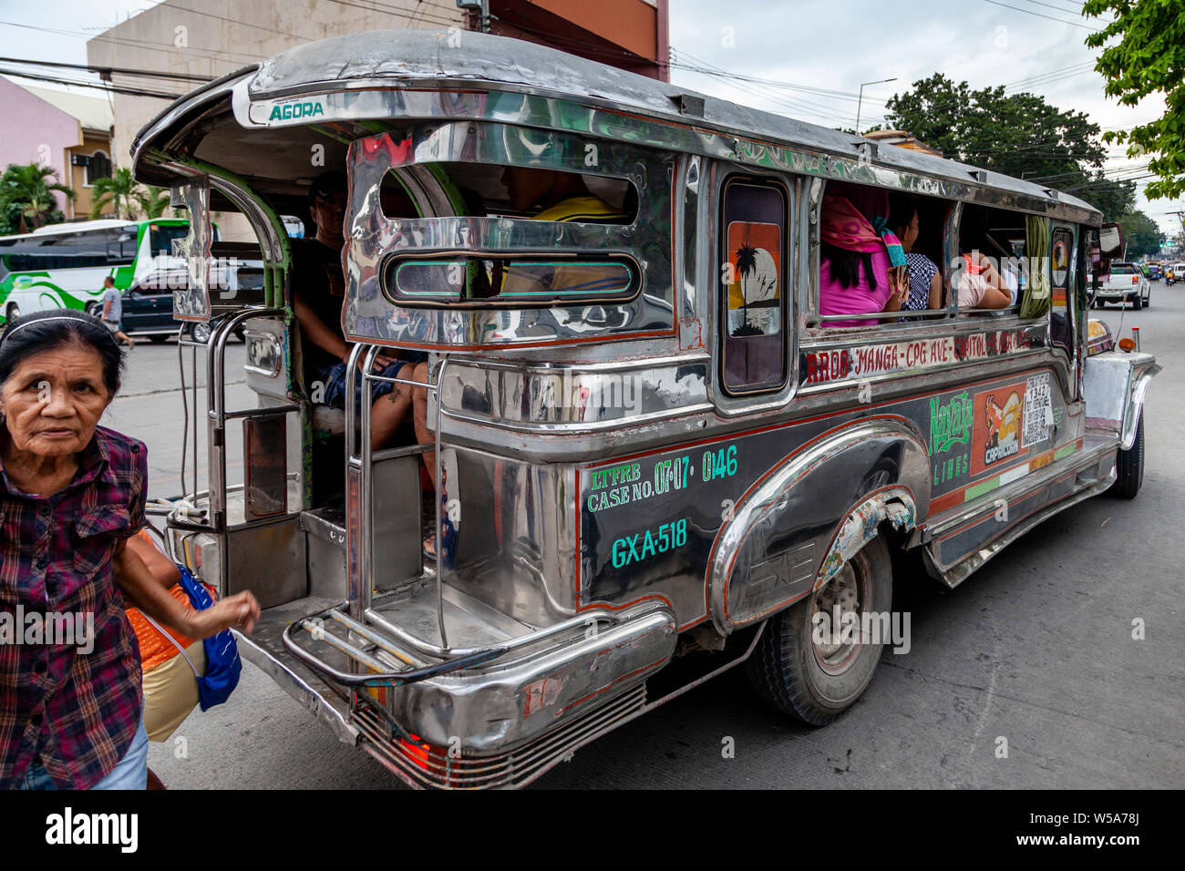 A Jeepney Drops Off Passengers, Tagbilaran City, Bohol, The Philippines ...