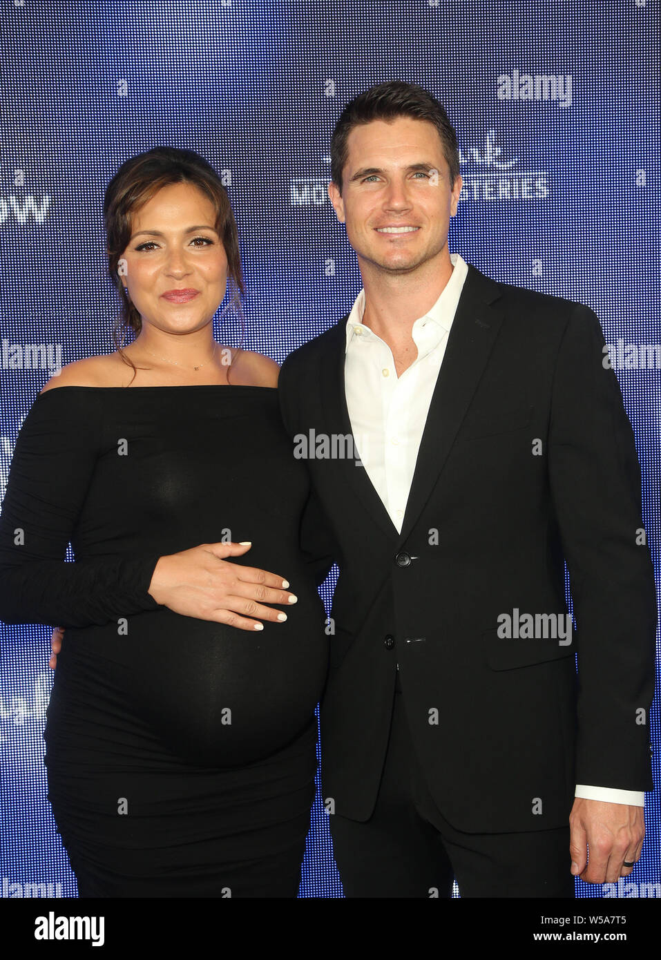 Beverly Hills, Ca. 26th July, 2019. Italia Ricci, Robbie Amell, at the ...