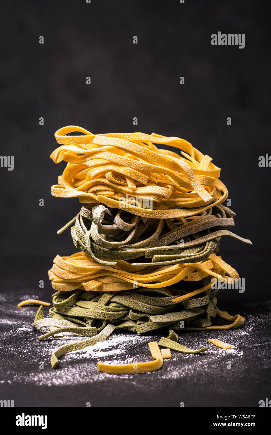straw and hay noodles, Italian pasta with different flavor and color ...