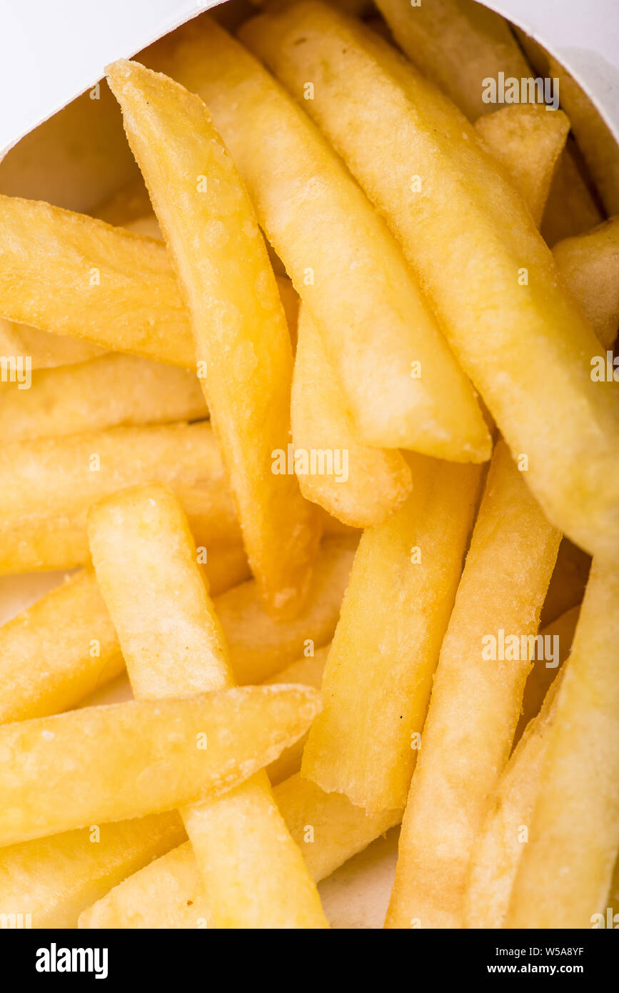 fried potatoes in the foreground cut into strips Stock Photo - Alamy