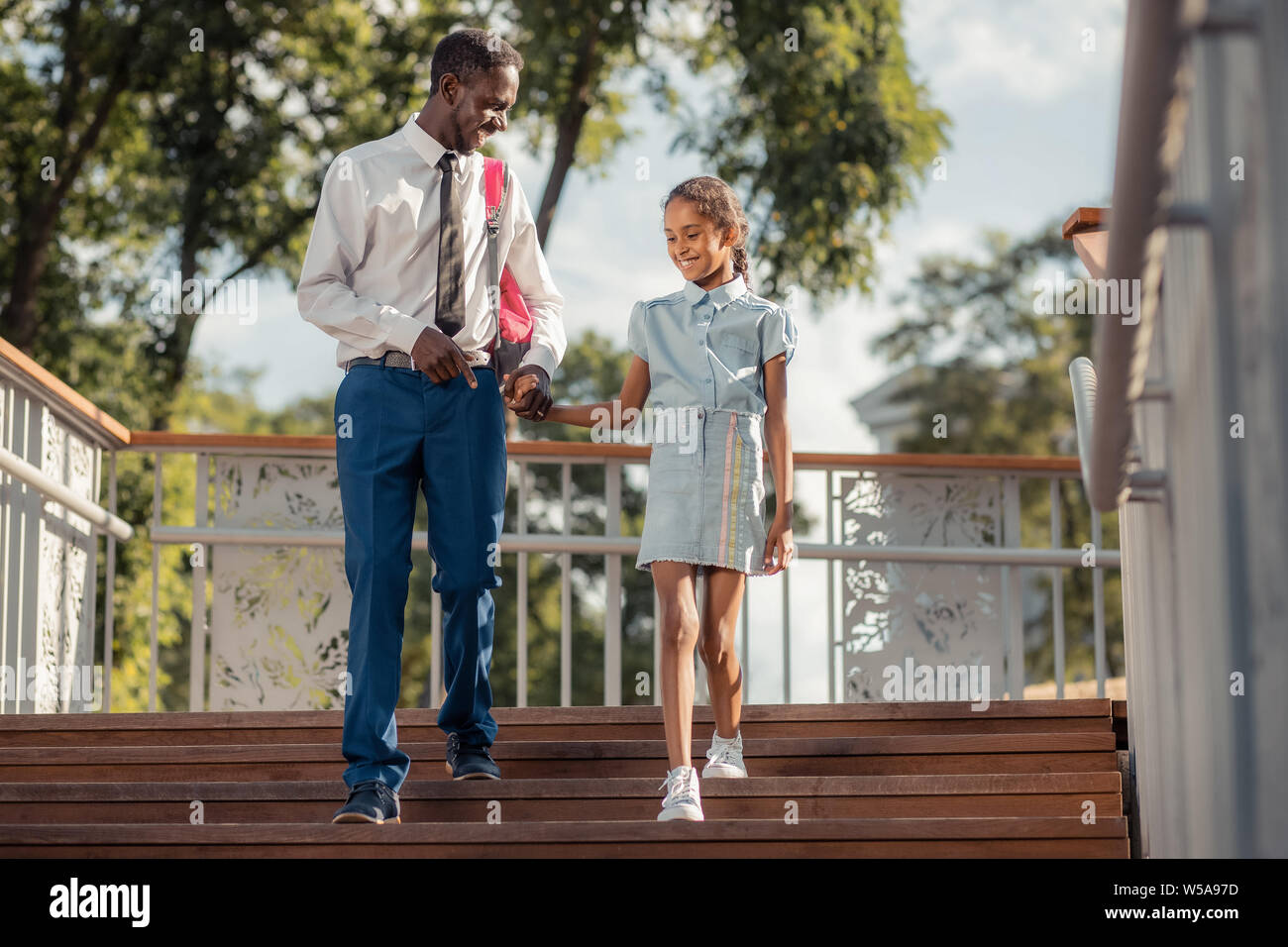 Pretty international schoolgirl going home after classes Stock Photo ...