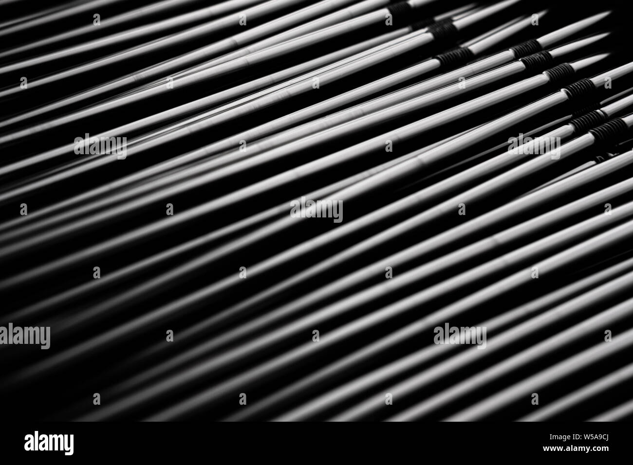 Stainless steel straws vertical abstract background. Metal pipes bundle ...