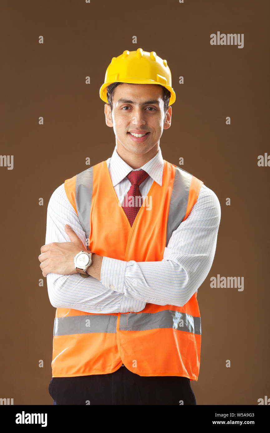 Portrait of a male architect smiling with his arms crossed Stock Photo ...